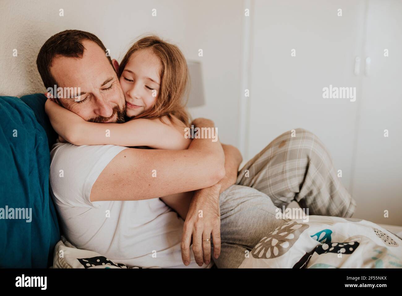 Daughter on fathers lap hi-res stock photography and images - Alamy