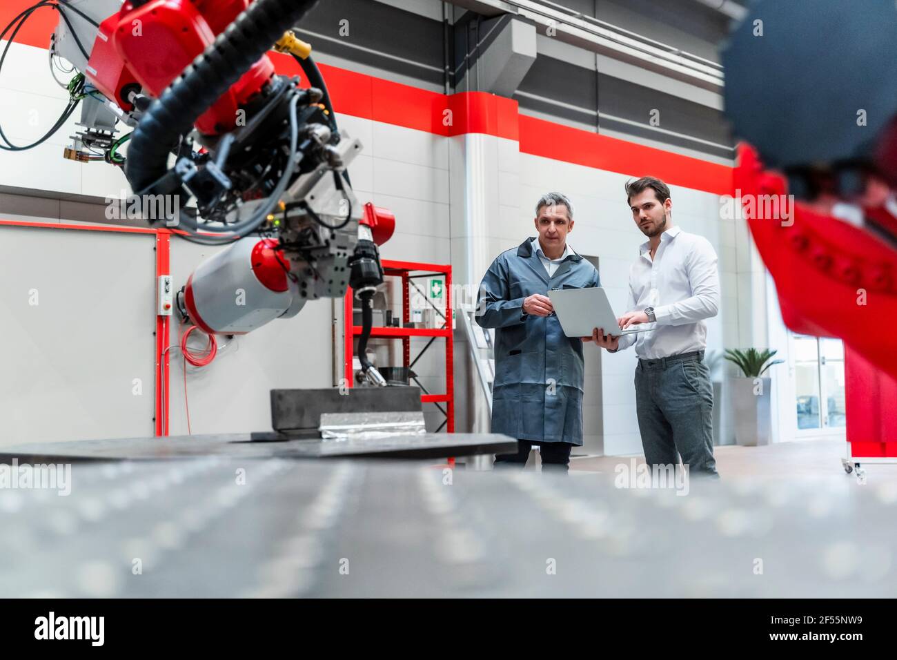 Two engineers looking at computer hi-res stock photography and images ...