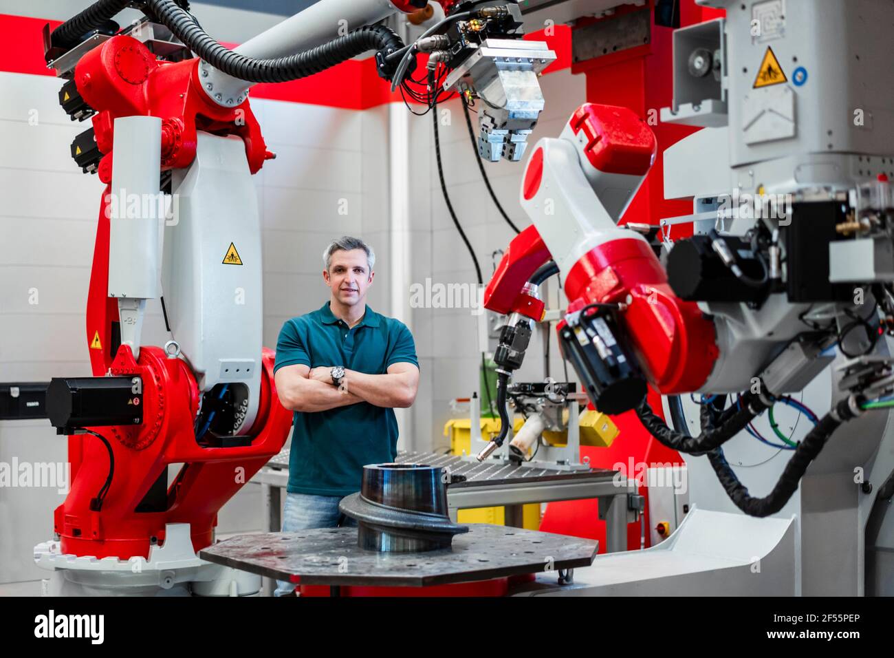 Man and machinery hi-res stock photography and images - Alamy
