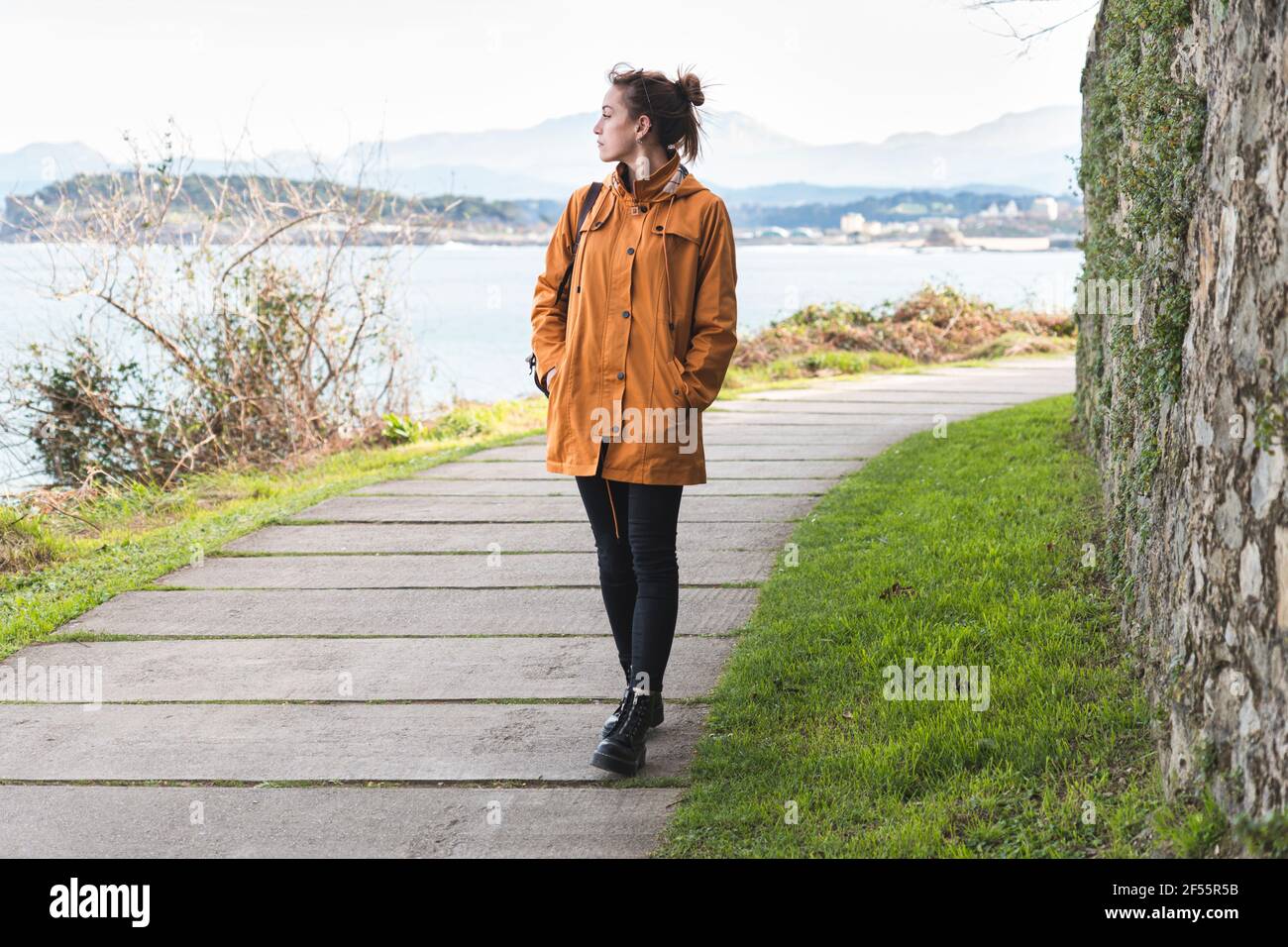 Woman walking alone hi-res stock photography and images - Alamy