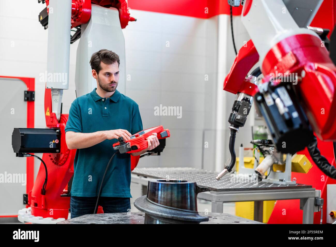 Worker operating machinery hi-res stock photography and images - Alamy
