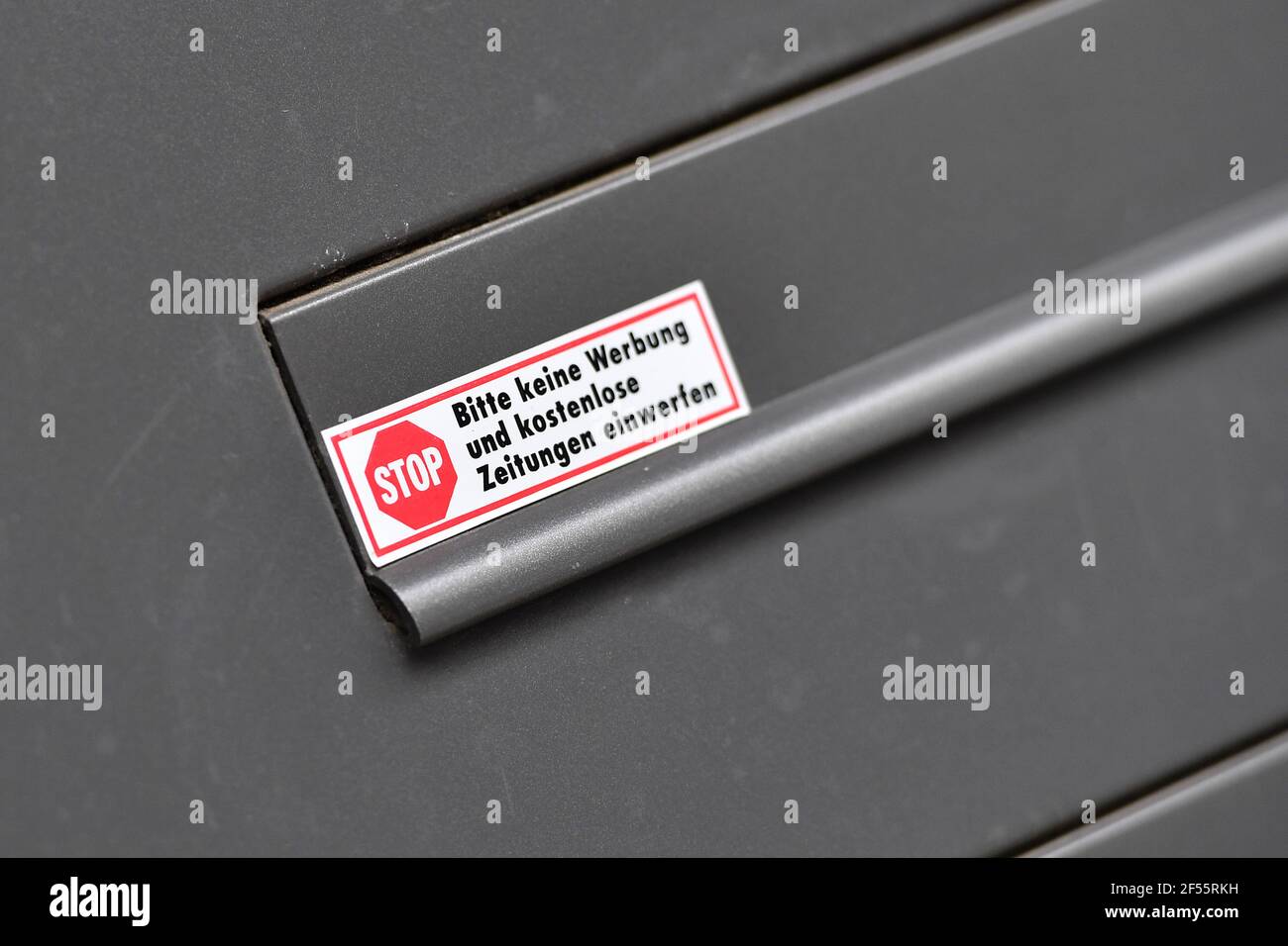 Munich, Deutschland. 23rd Mar, 2021. Sticker in a slot on a mailbox ...
