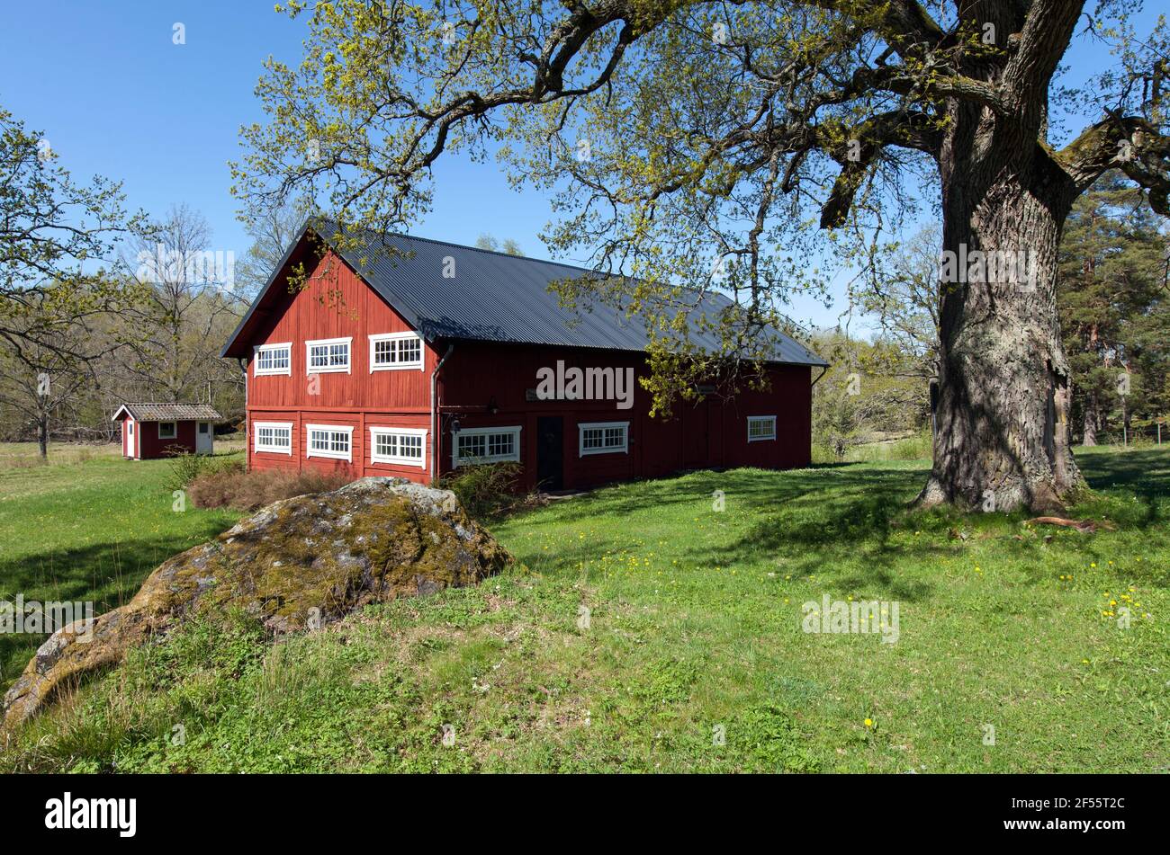 MALARDALEN, SWEDEN ON MAY 13, 2012.View of a red, well preserved barn ...
