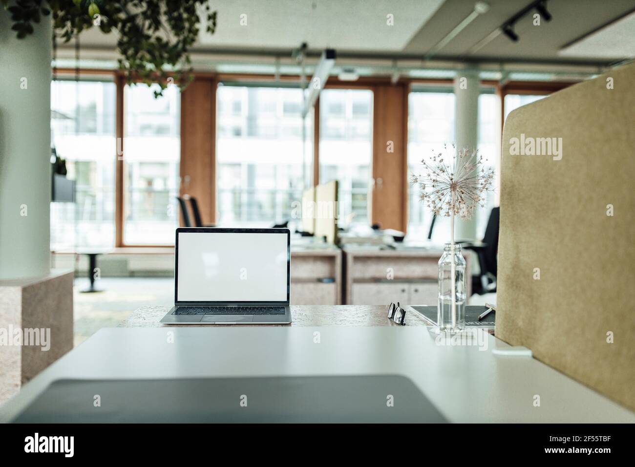 Laptop on desk in office Stock Photo - Alamy