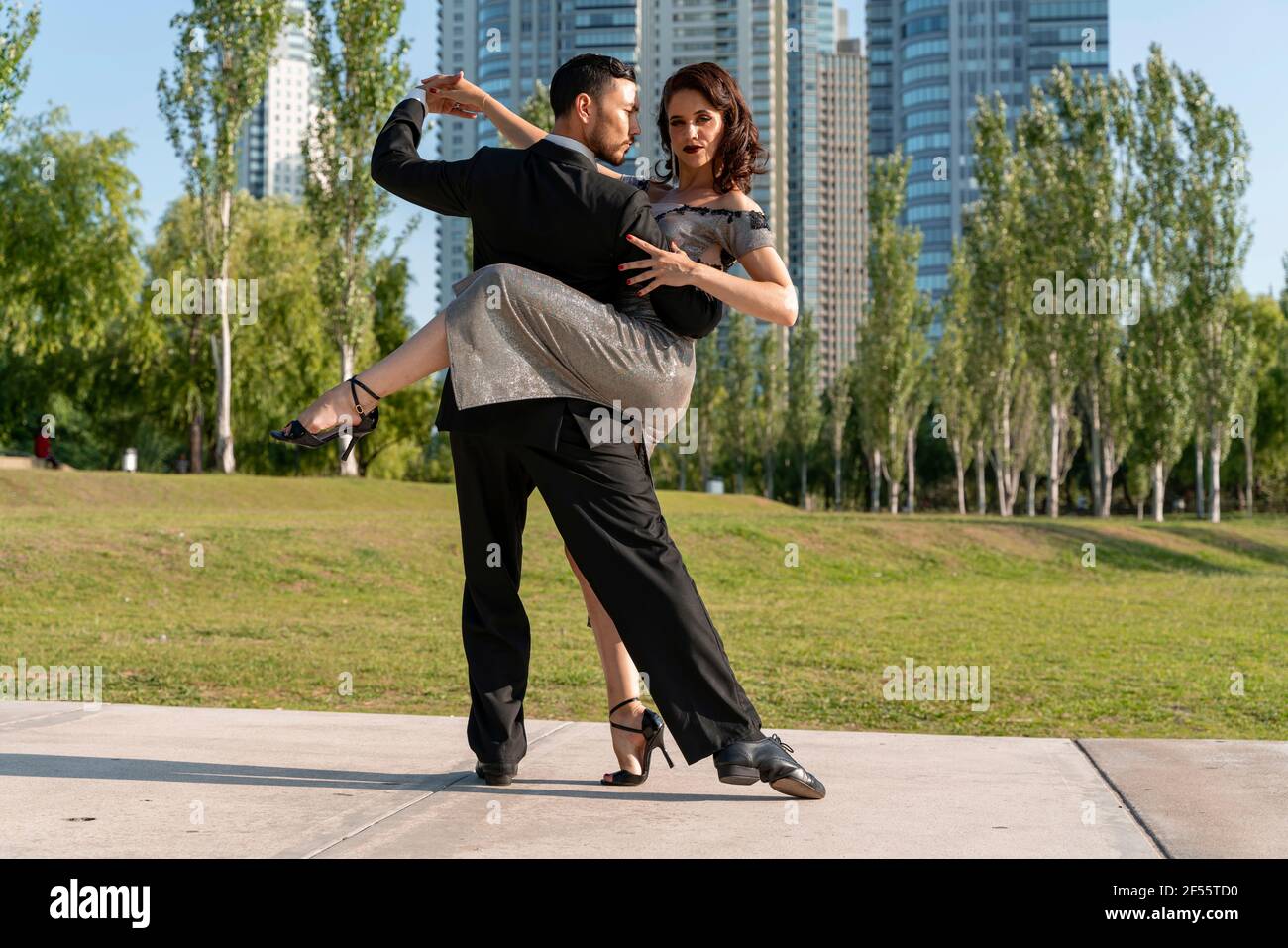 Male and female Tango dancers doing rehearsal in public park Stock ...