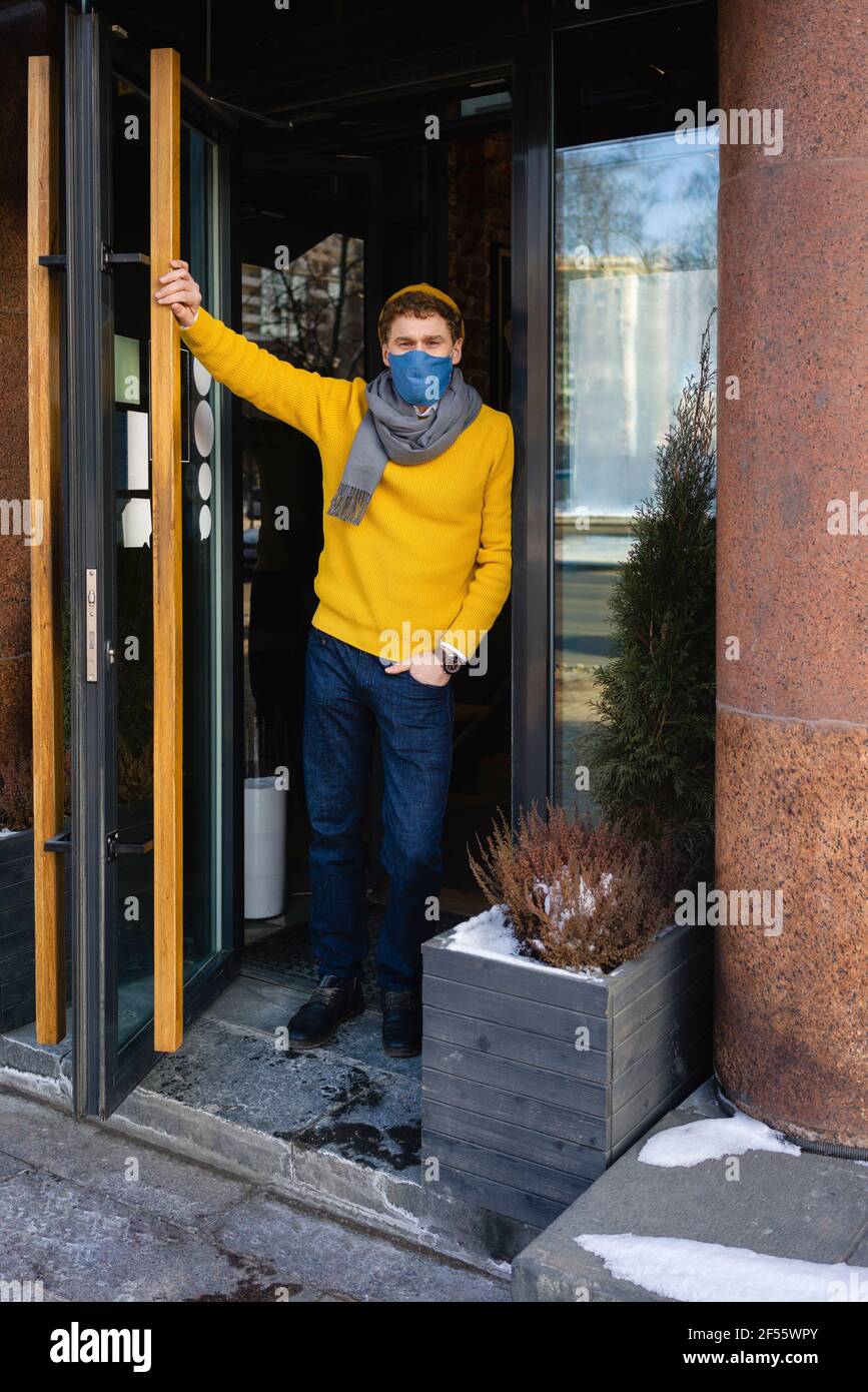 Holding door hi-res stock photography and images - Alamy