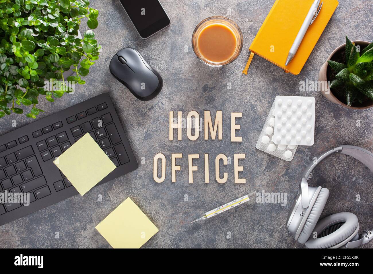 work from home text desk with keyboard computer smartphone notebook ...