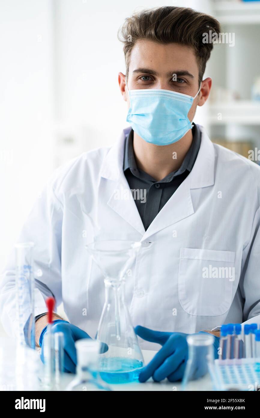 Male scientist wearing protective mask hi-res stock photography and ...