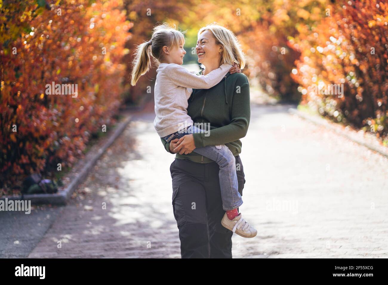 Mother daughter smiling walking hi-res stock photography and images - Alamy