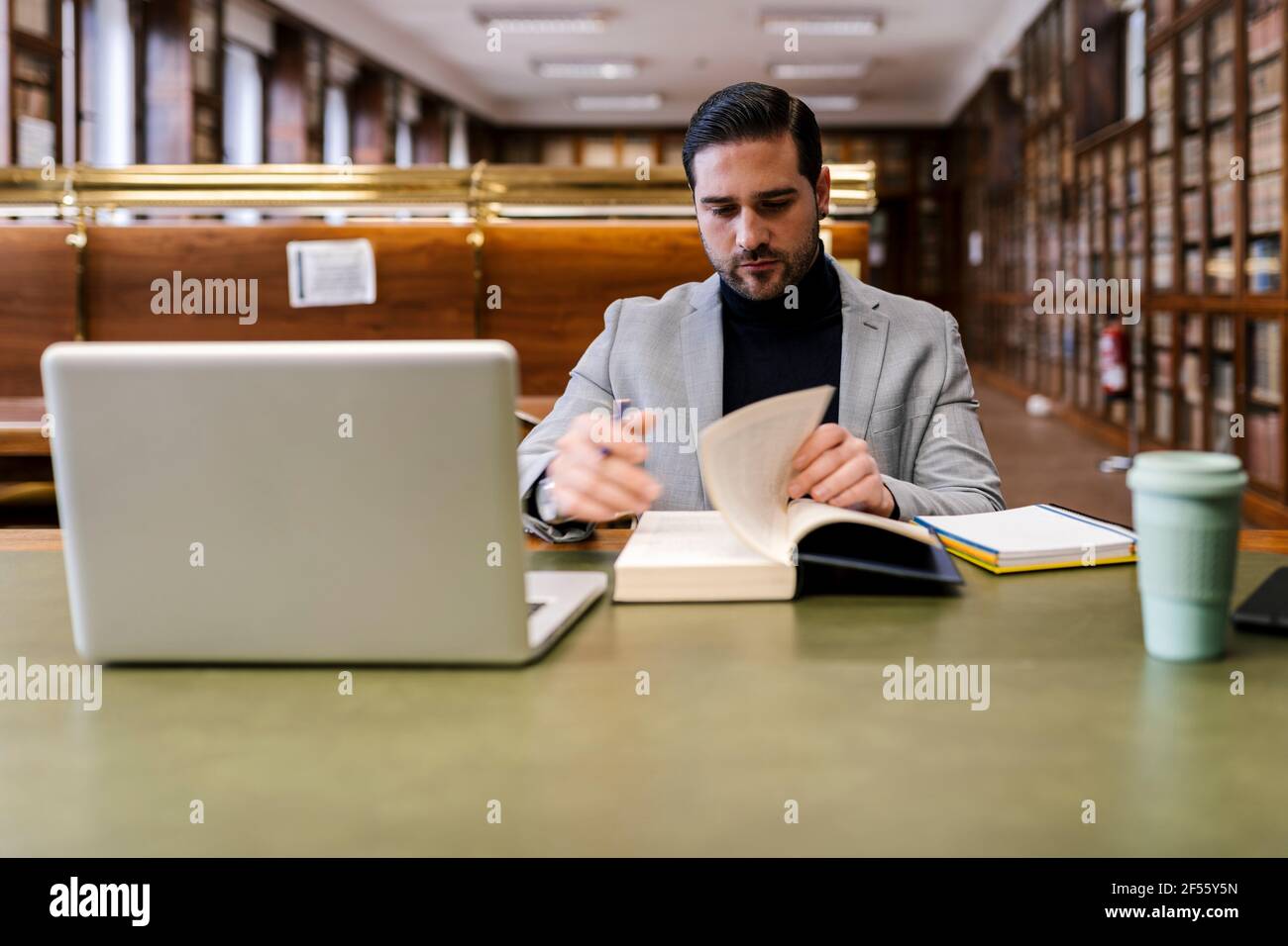 Businessman laptop reading in hi-res stock photography and images - Alamy