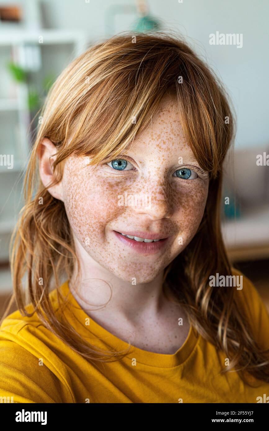 Cute smiling redhead girl at home Stock Photo - Alamy