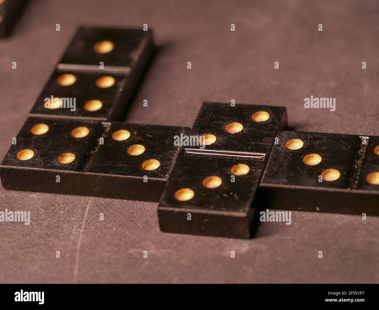 Domino formed in different ways, black, on white background. Each piece ...
