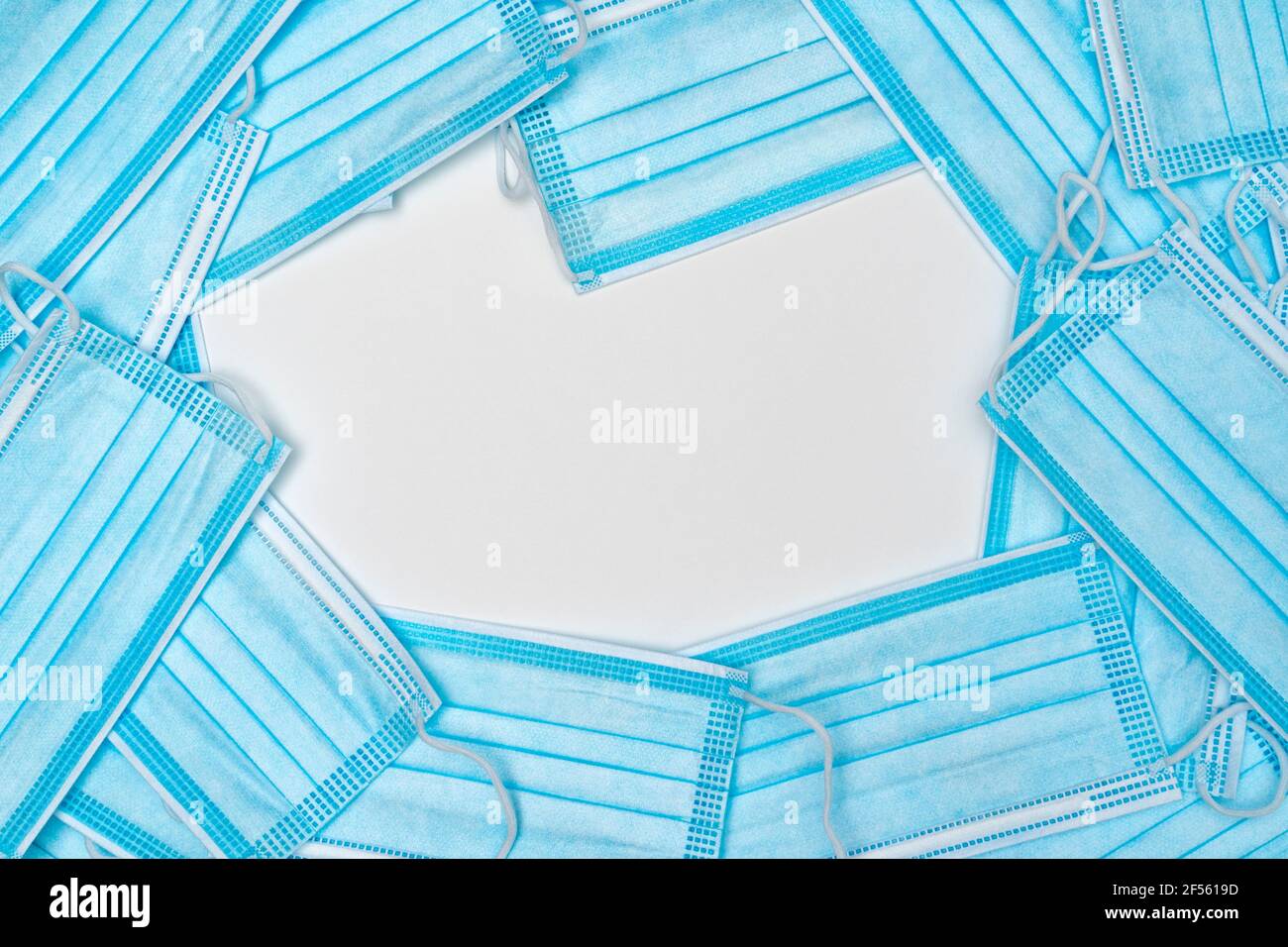 Frame from medical face masks on a white background. Empty space for ...