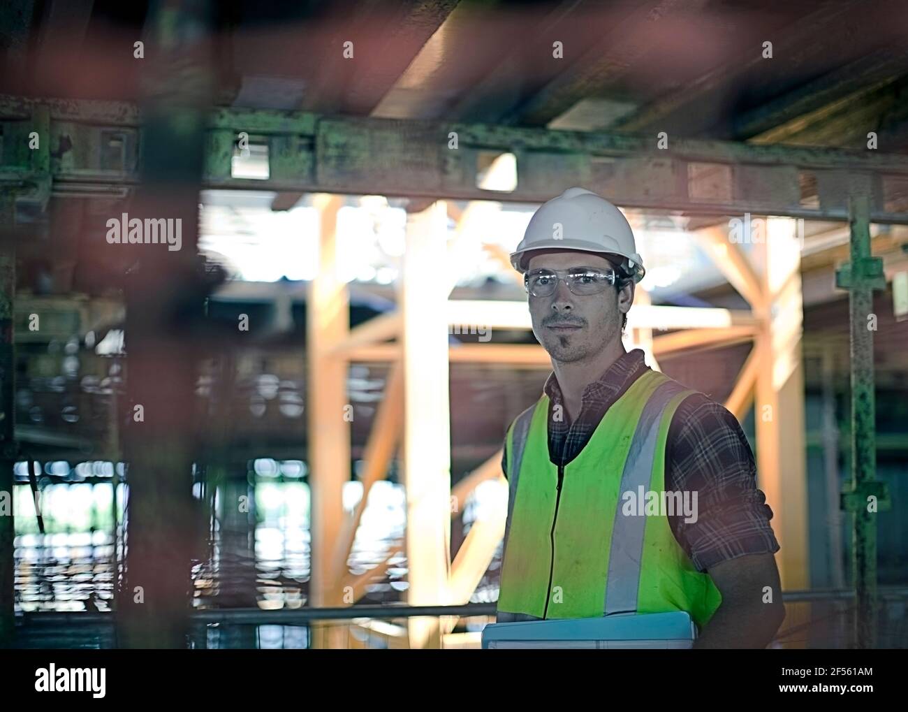 Confident male construction worker at construction site Stock Photo - Alamy