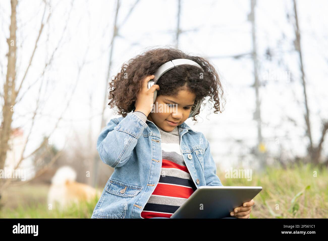 Boy using computer with headphones hi-res stock photography and images ...
