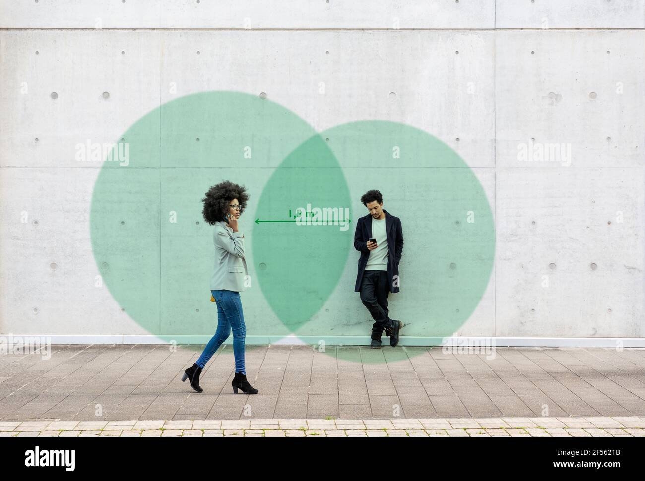 Two overlapping circles visualizing social distancing covering man and ...