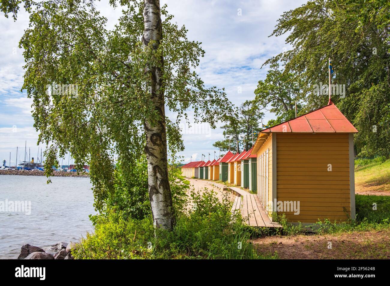 Beach with colorful huts in the city Hjo in Sweden Stock Photo - Alamy