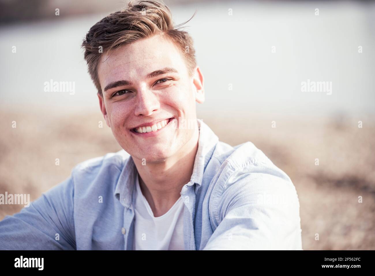 Cheerful smiling young handsome man hi-res stock photography and images ...