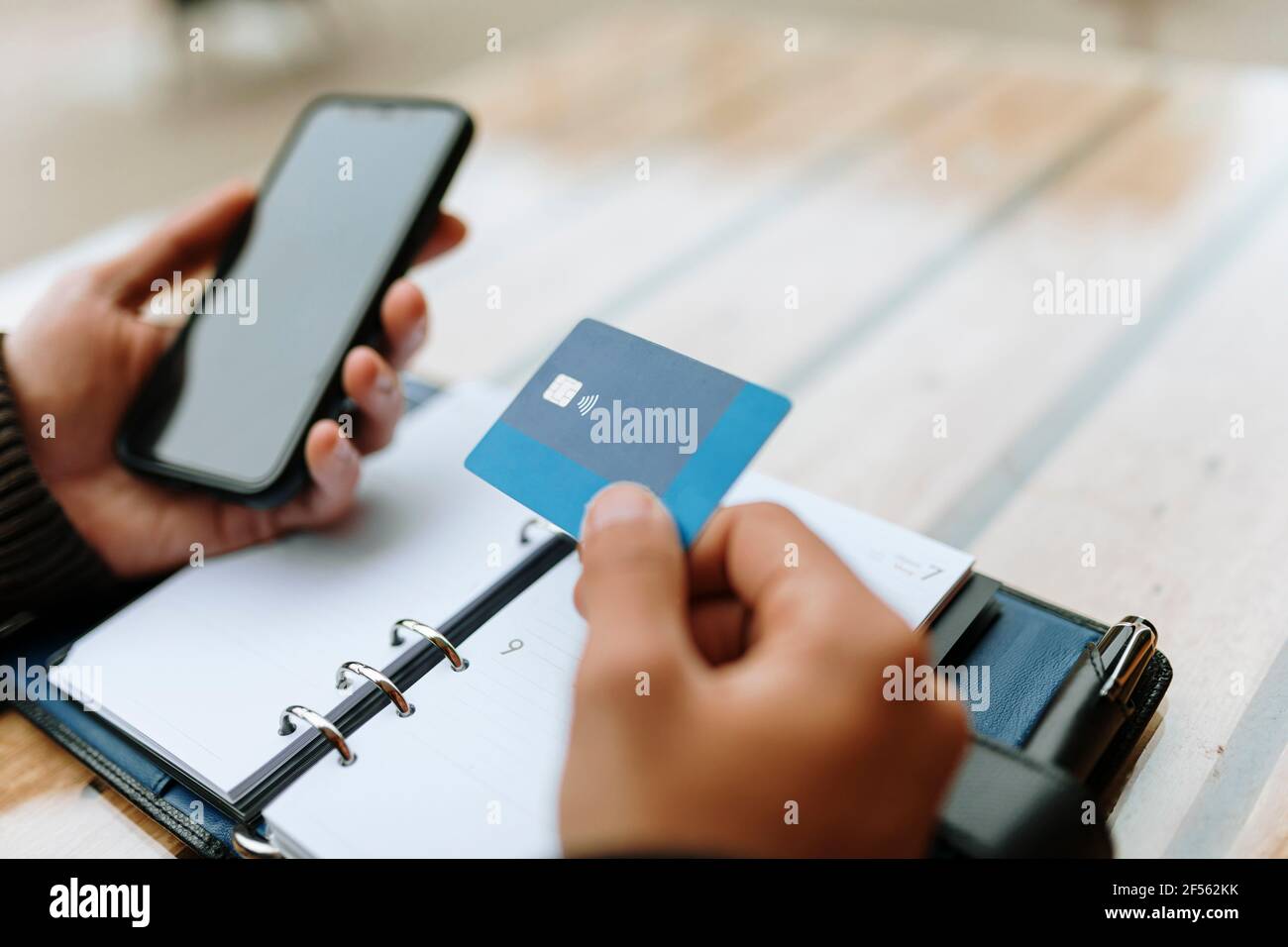 Man using credit card to pay bills Stock Photo - Alamy