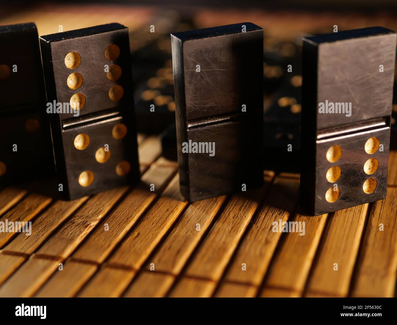 Domino formed in different ways, black, on white background. Each piece ...