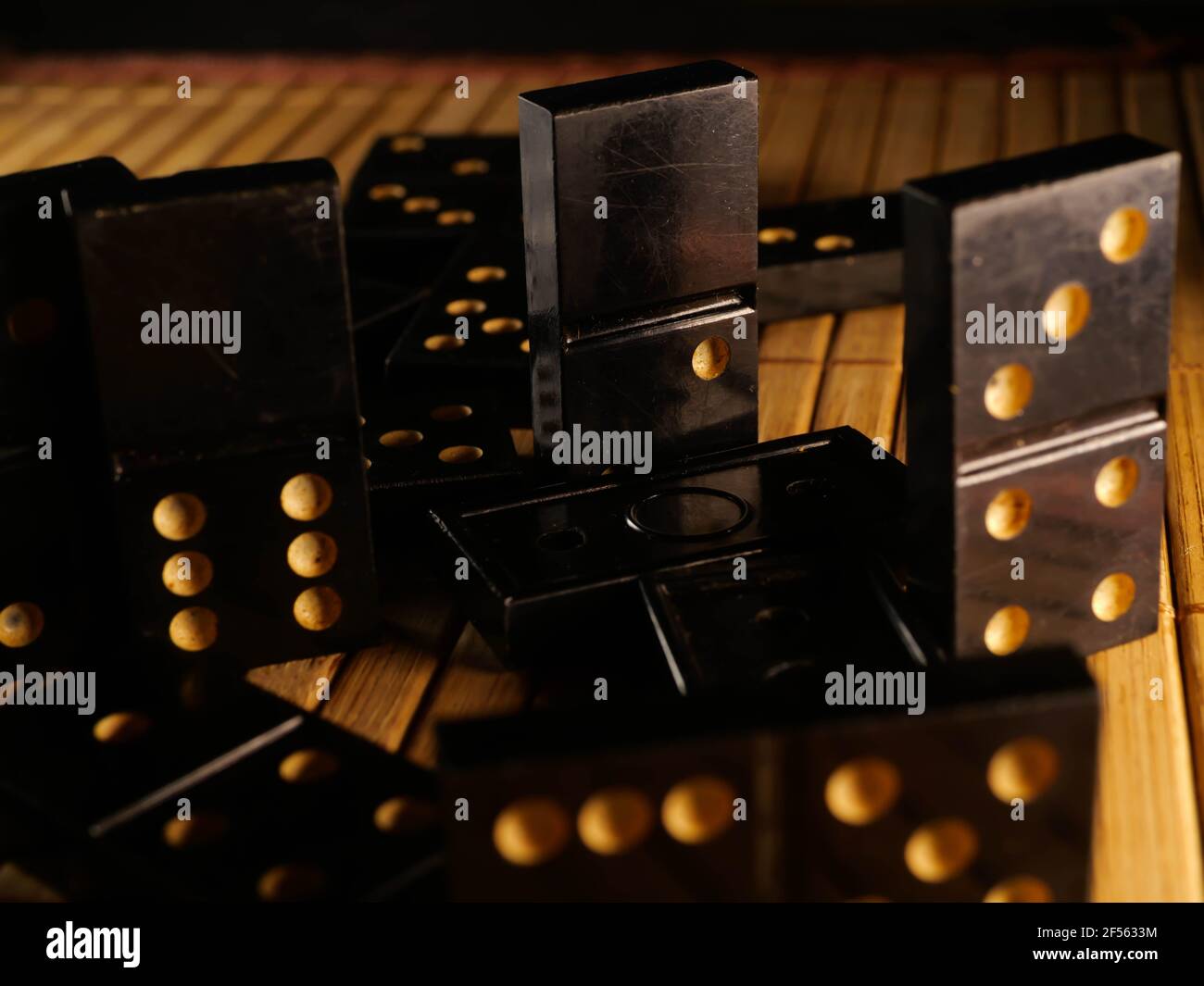 Domino formed in different ways, black, on white background. Each piece ...