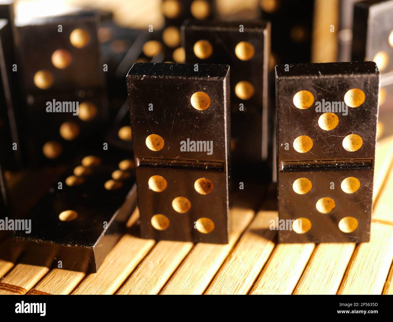 Domino formed in different ways, black, on white background. Each piece ...