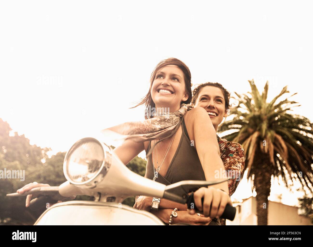 Happy people ride scooter hi-res stock photography and images - Alamy