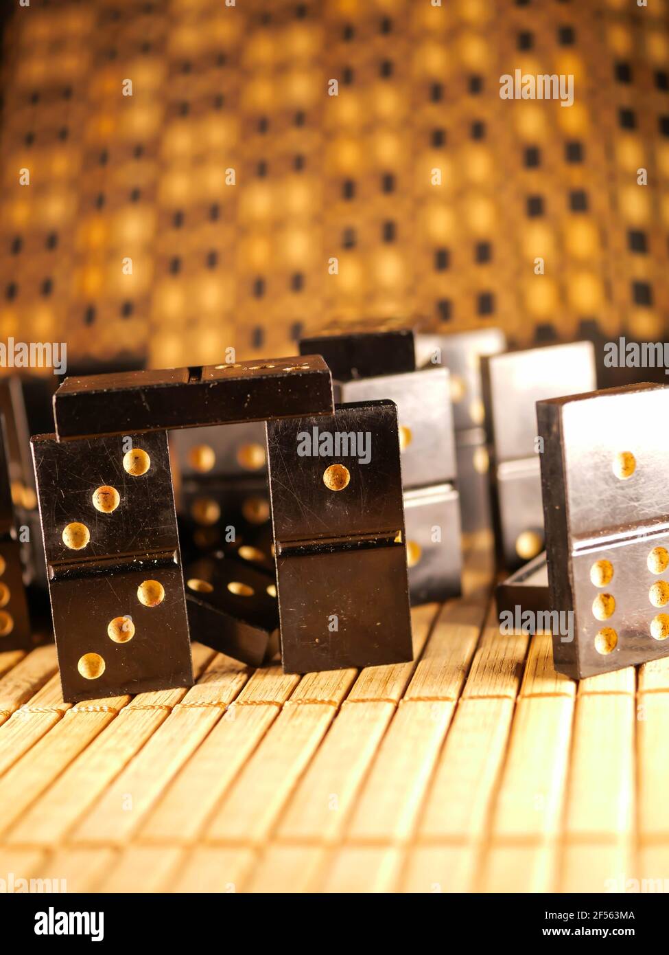 Domino formed in different ways, black, on white background. Each piece ...
