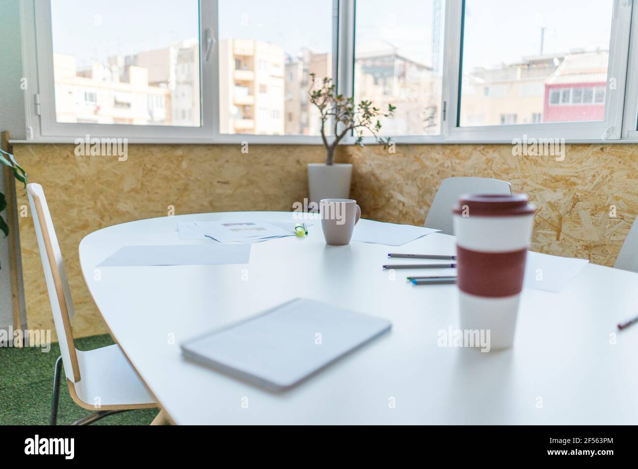 Empty conference table with documents and coffee cups in office Stock ...
