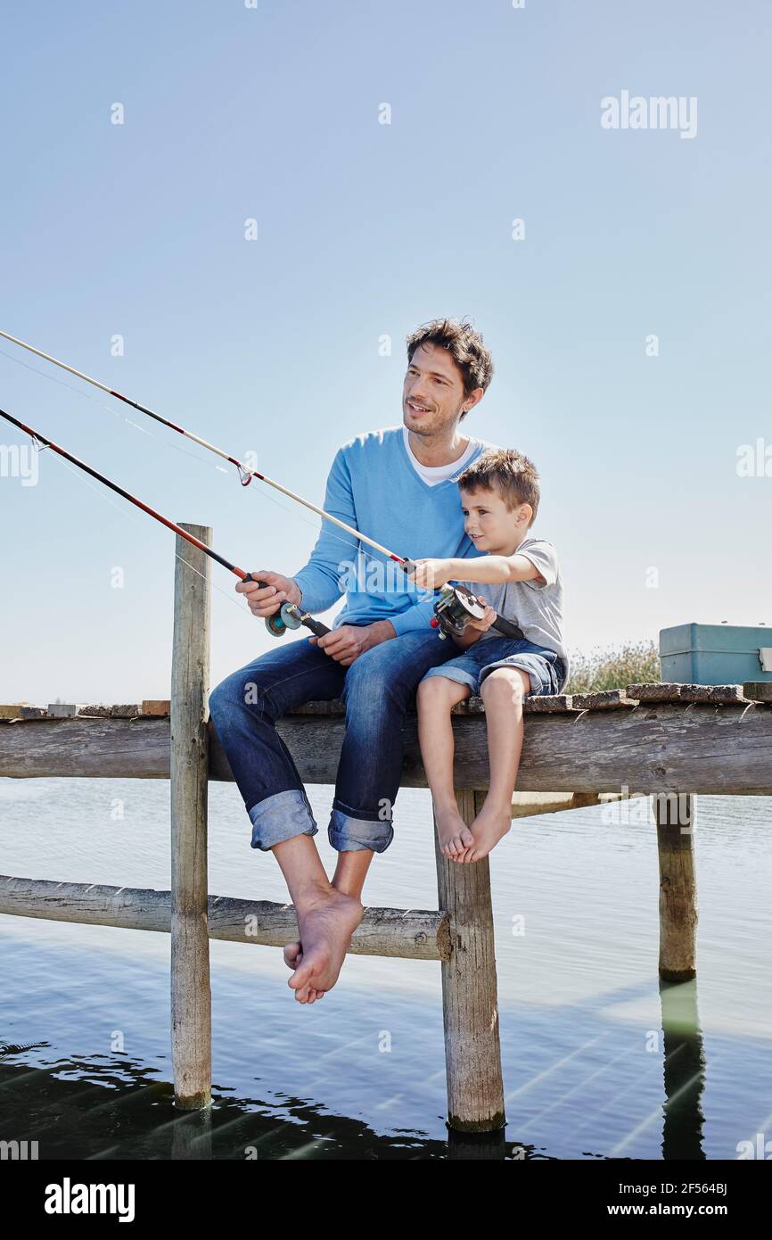 Boy fishing pier hi-res stock photography and images - Alamy