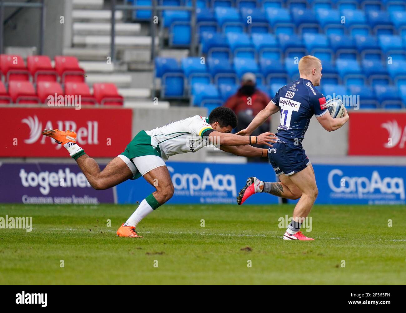 Sale Sharks wing Aaron Reed breaks away from London Irish Wing Ben ...