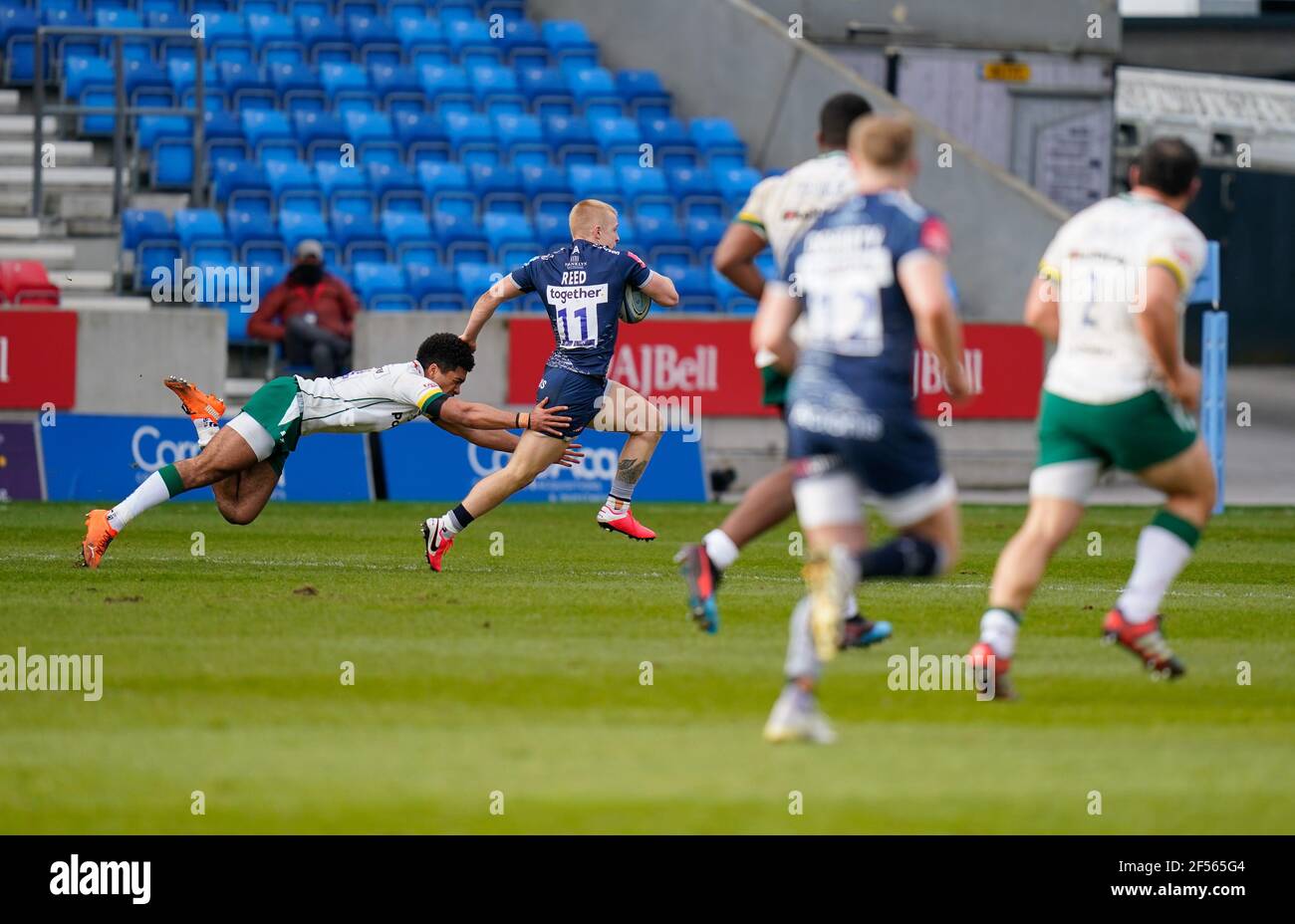 Sale Sharks wing Aaron Reed breaks away from London Irish Wing Ben ...