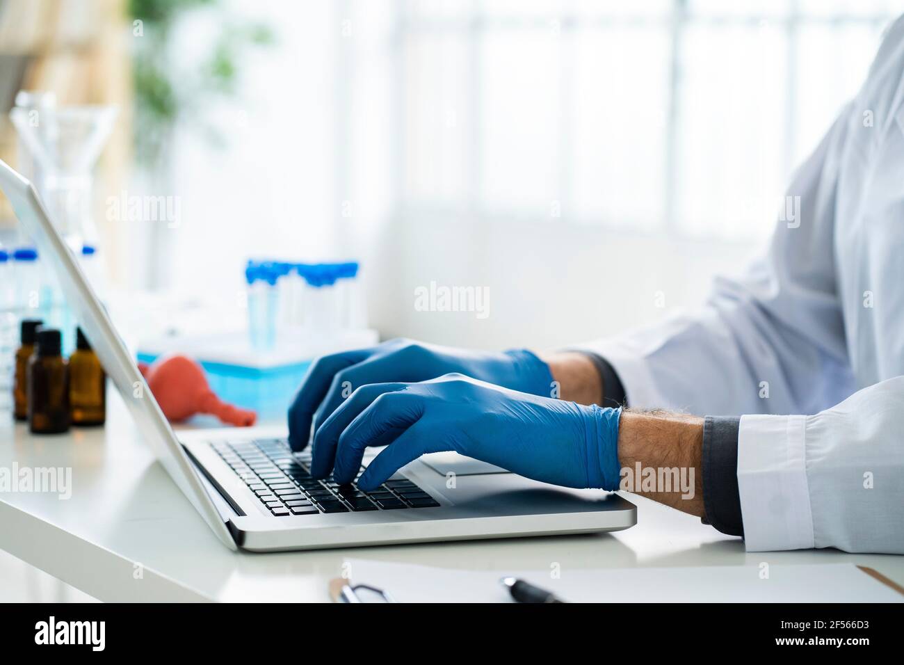 Male scientist working on desk hi-res stock photography and images - Alamy