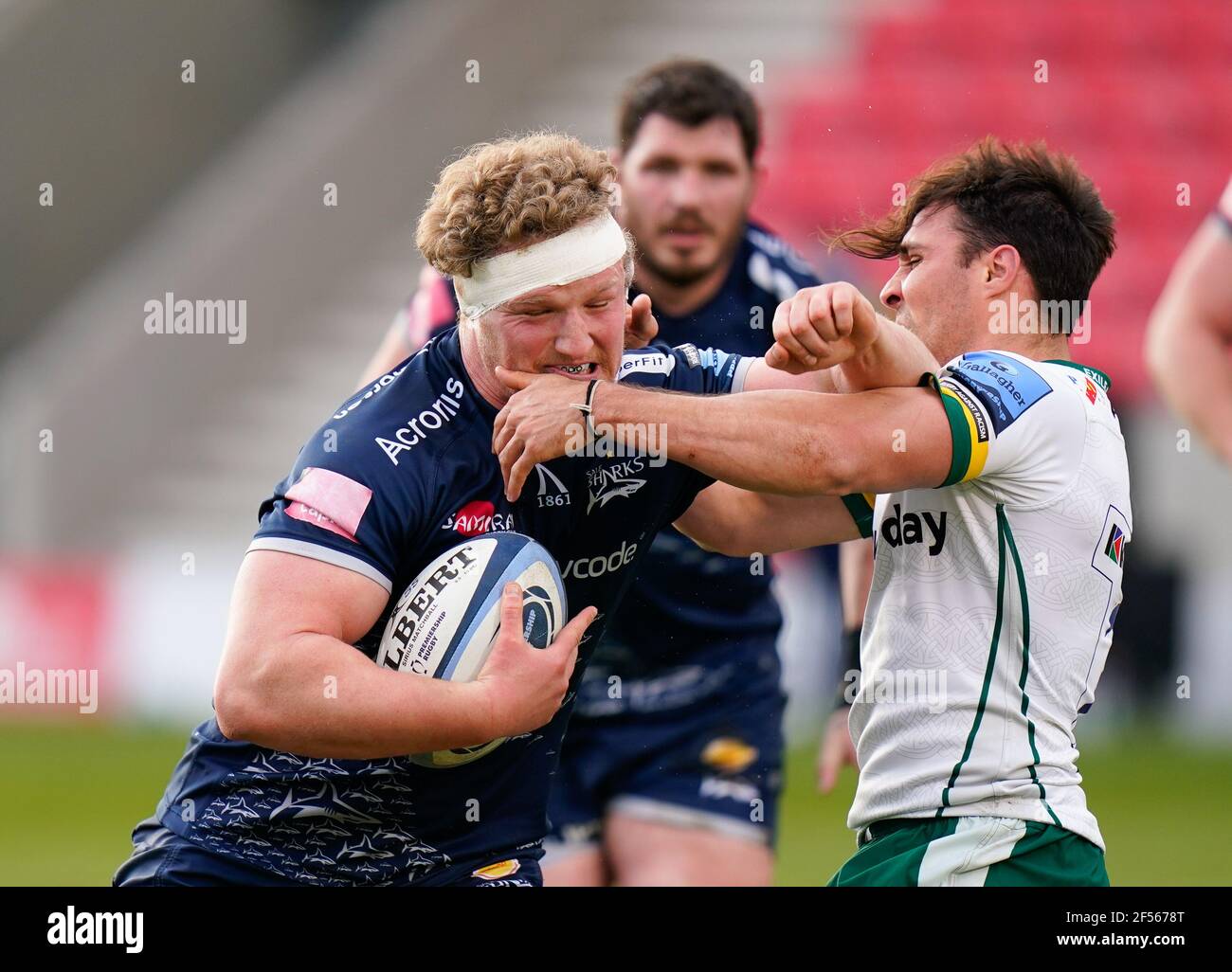 Sale Sharks Ross Harrison leads with his arm into London Irish Nick ...