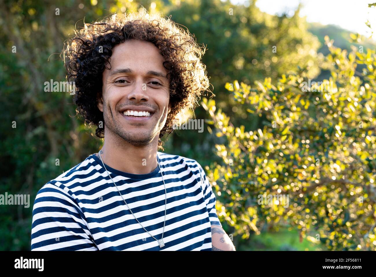 Young man smiling hi-res stock photography and images - Alamy