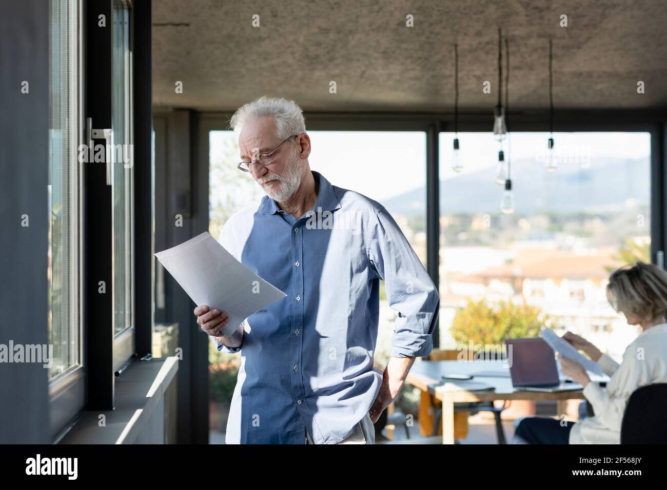 Two men reading paper hi-res stock photography and images - Alamy