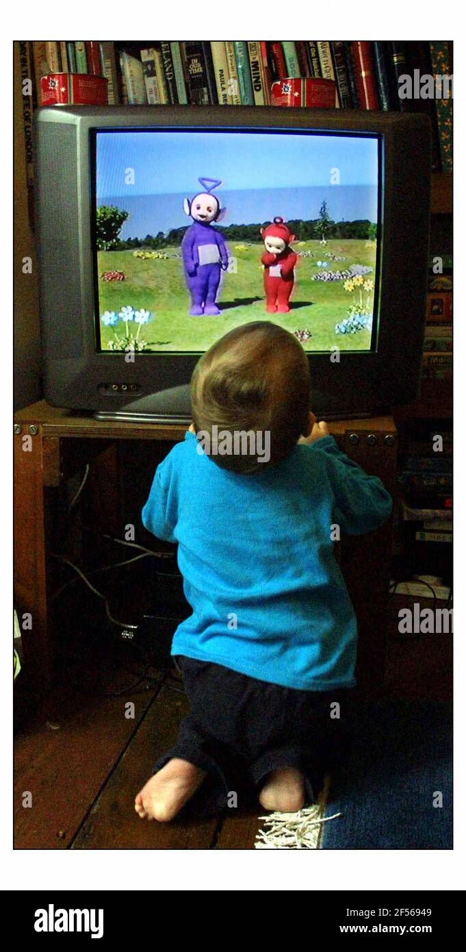 Oliver Bennett watching Tv with his son Bruno.pic David Sandison 30/10 ...