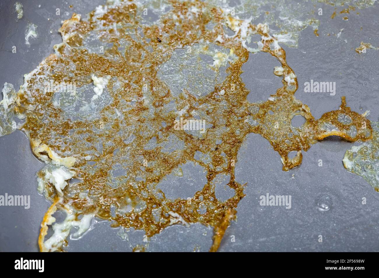 Burnt fried egg hi-res stock photography and images - Alamy