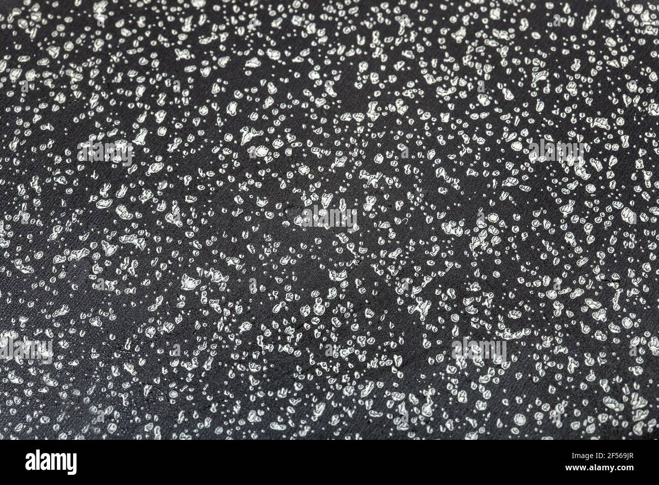 clean surface of a frying pan with a non-stick coating of dark color ...