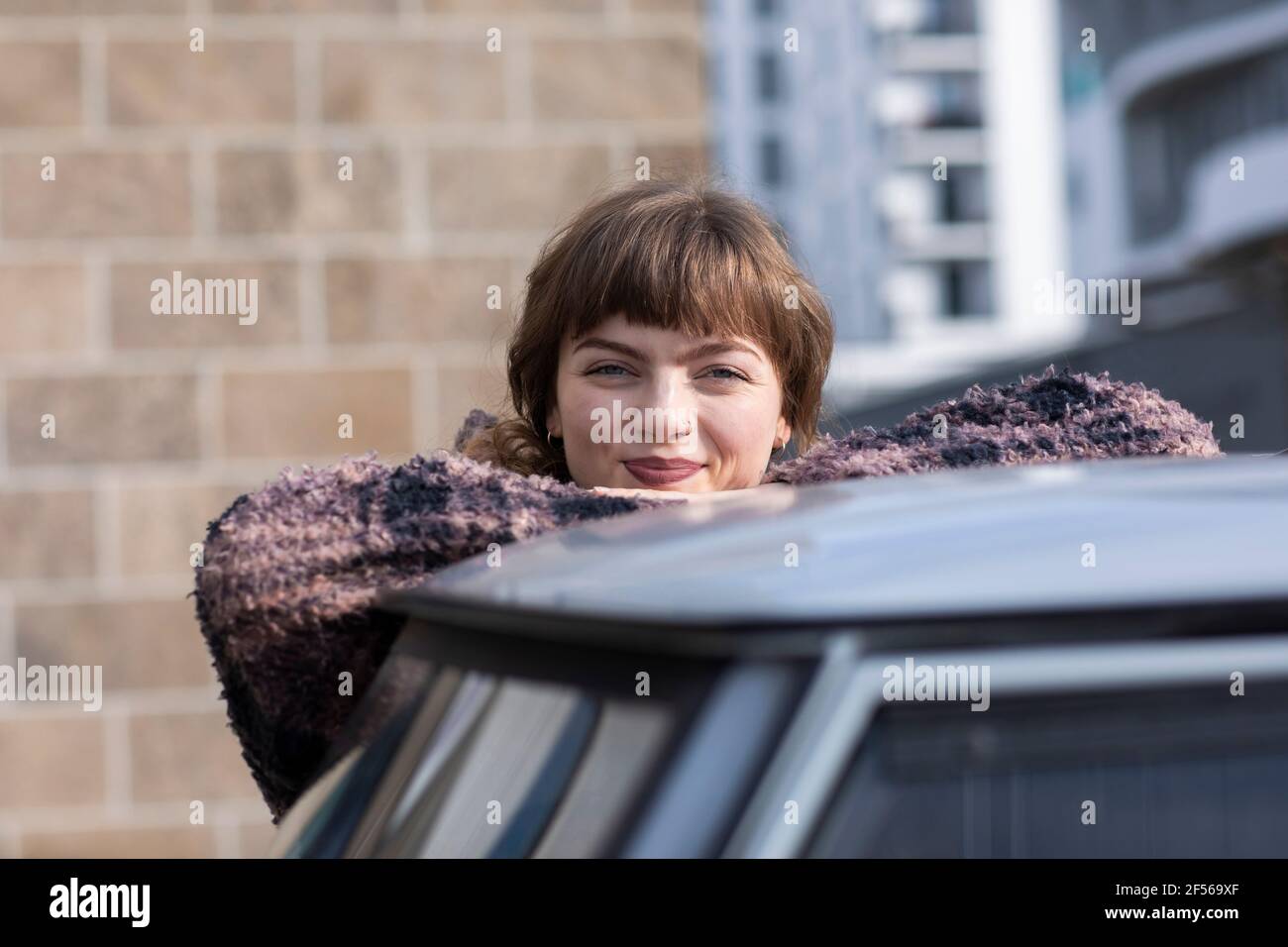 Woman standing on roof car hi-res stock photography and images - Alamy