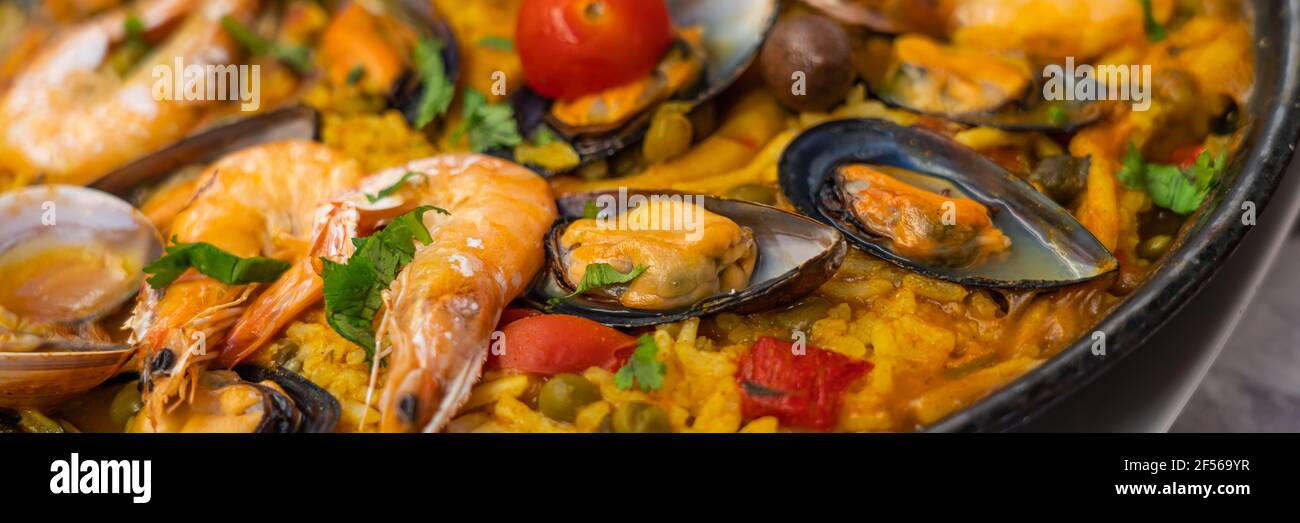 Spanish seafood Paella de Marisco, Paella Marinera with mussels ...