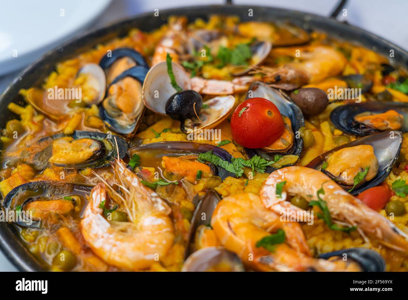Spanish seafood Paella de Marisco, Paella Marinera with mussels ...