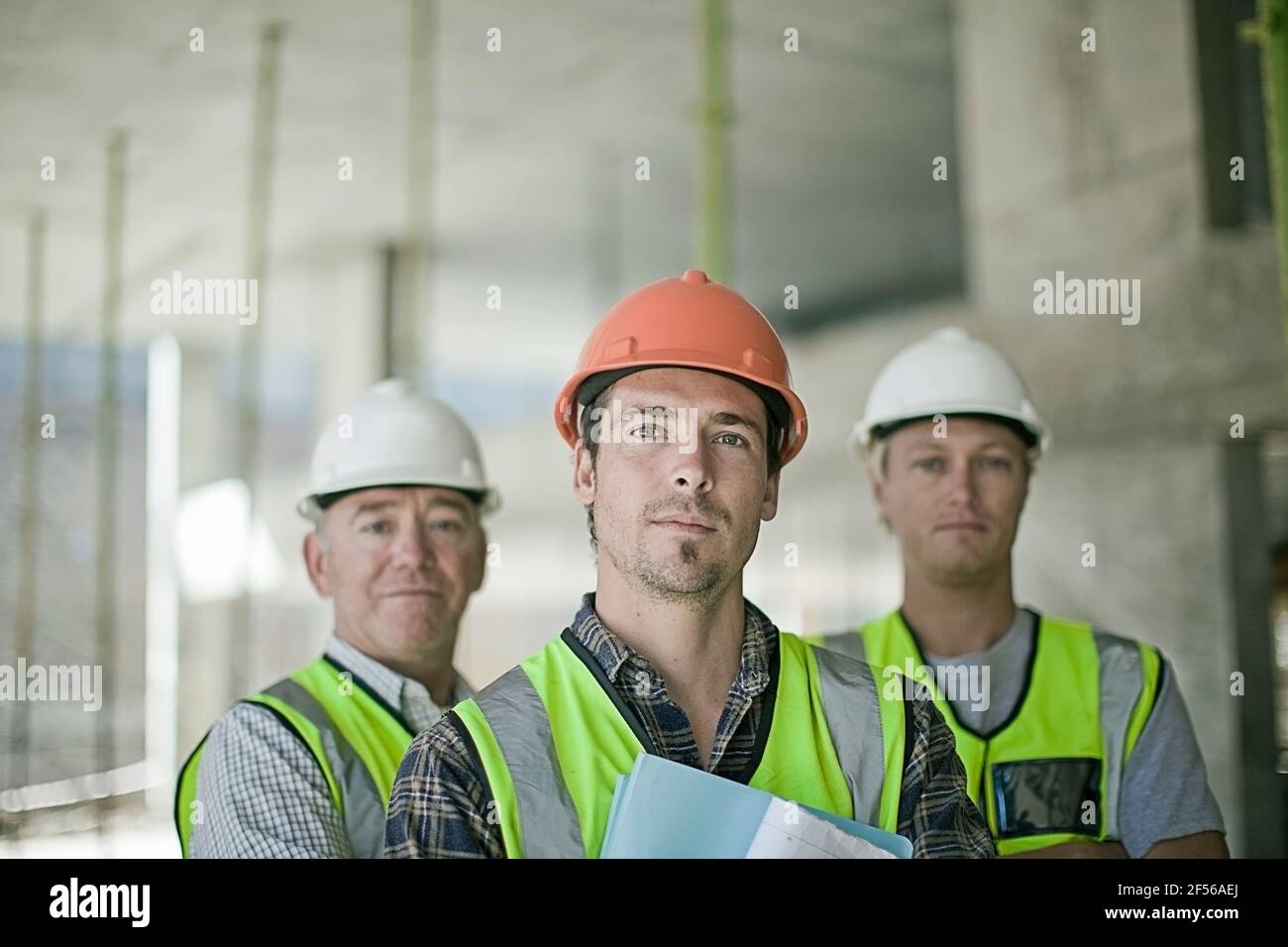 Portrait of three male construction workers wearing hardhats Stock Photo - Alamy