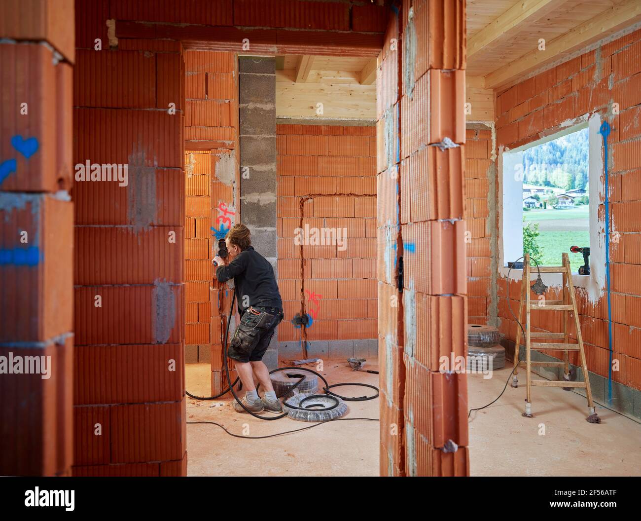 Male electrician with equipment working at construction site Stock ...