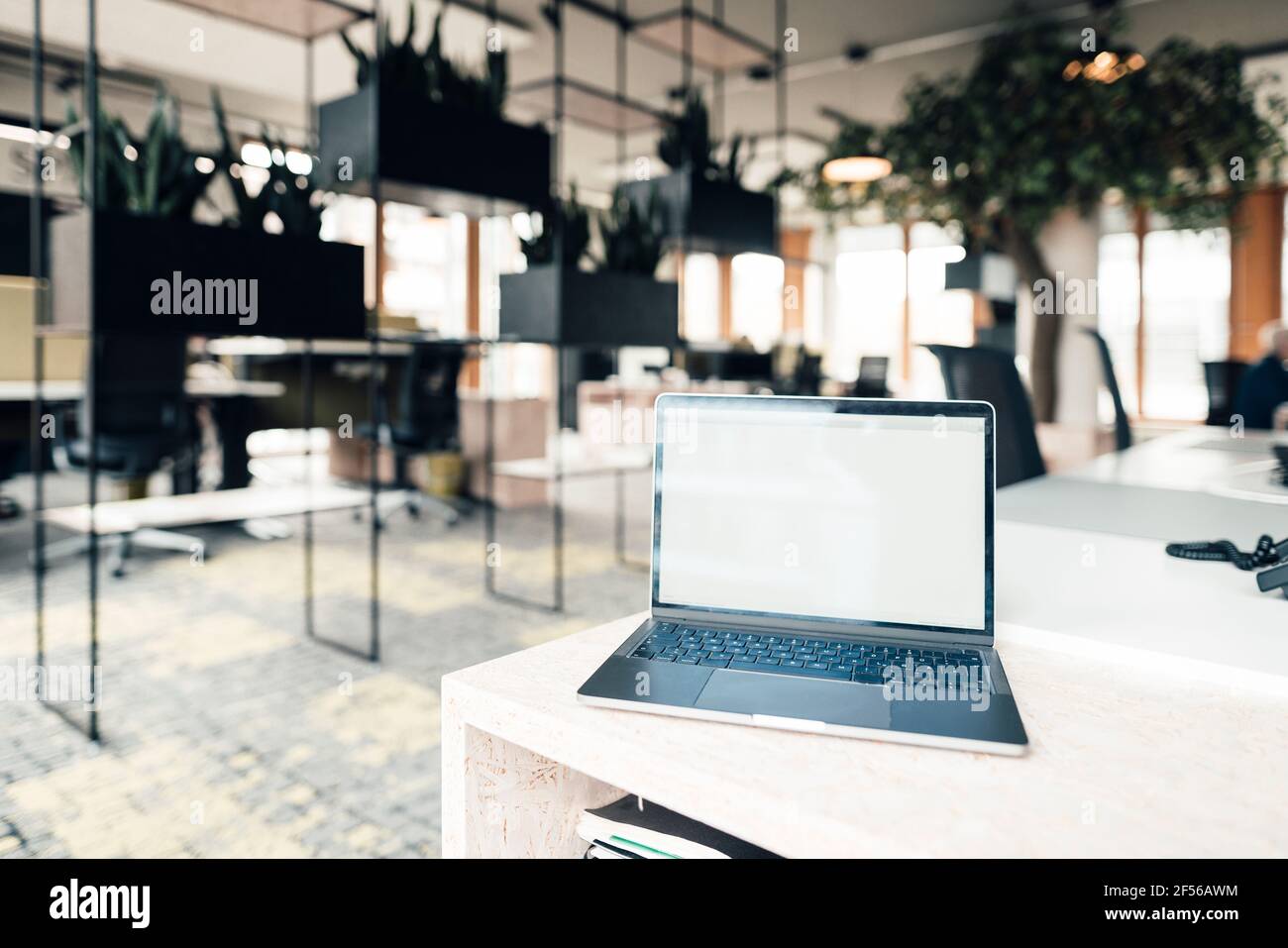 Laptop on desk at office Stock Photo - Alamy