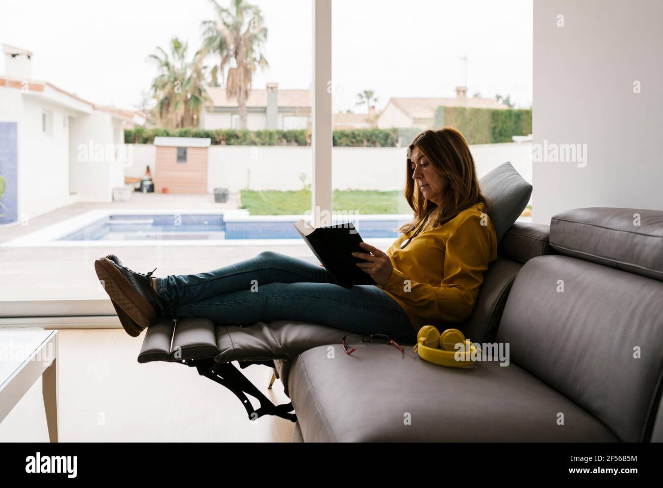 Reclining chair woman hi-res stock photography and images - Alamy