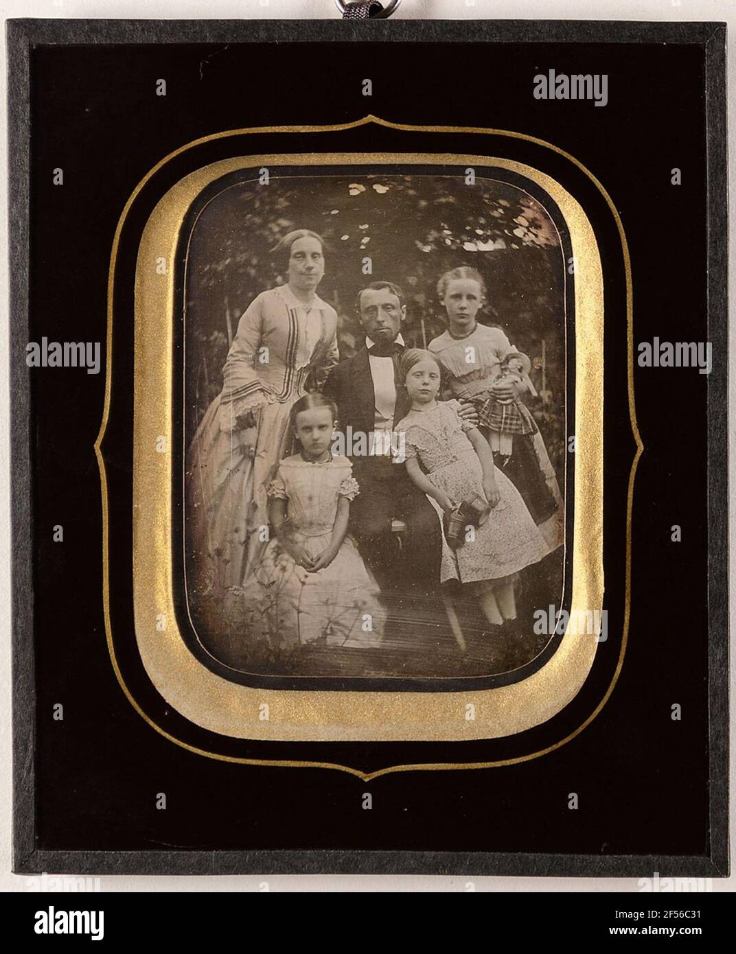 Unknown family with three daughters Stock Photo - Alamy