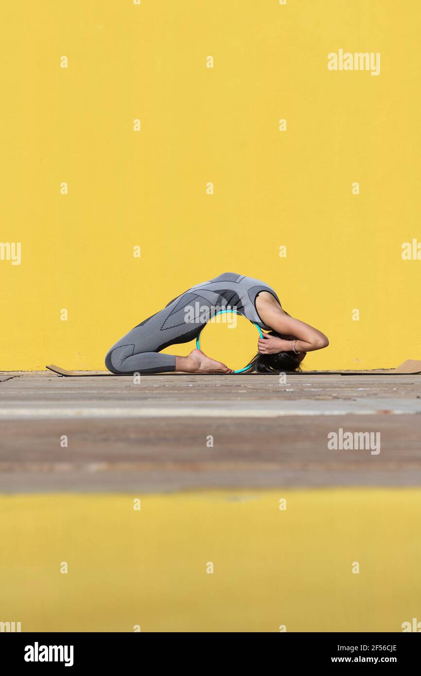 Young woman bending over outdoors hi-res stock photography and images ...