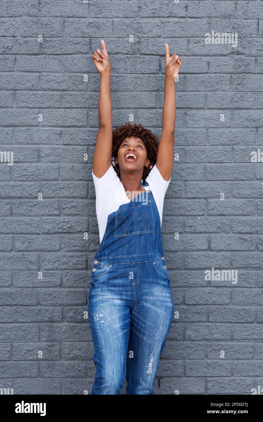 Beautiful african lady pointing hi-res stock photography and images - Alamy