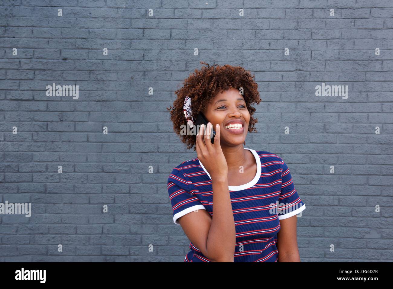 Black african girl talking hi-res stock photography and images - Alamy